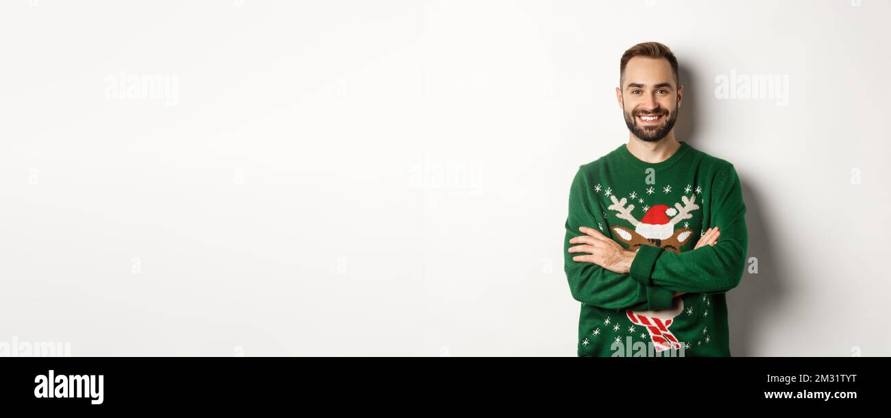 New Year party and winter holidays concept. Happy bearded man in funny ...