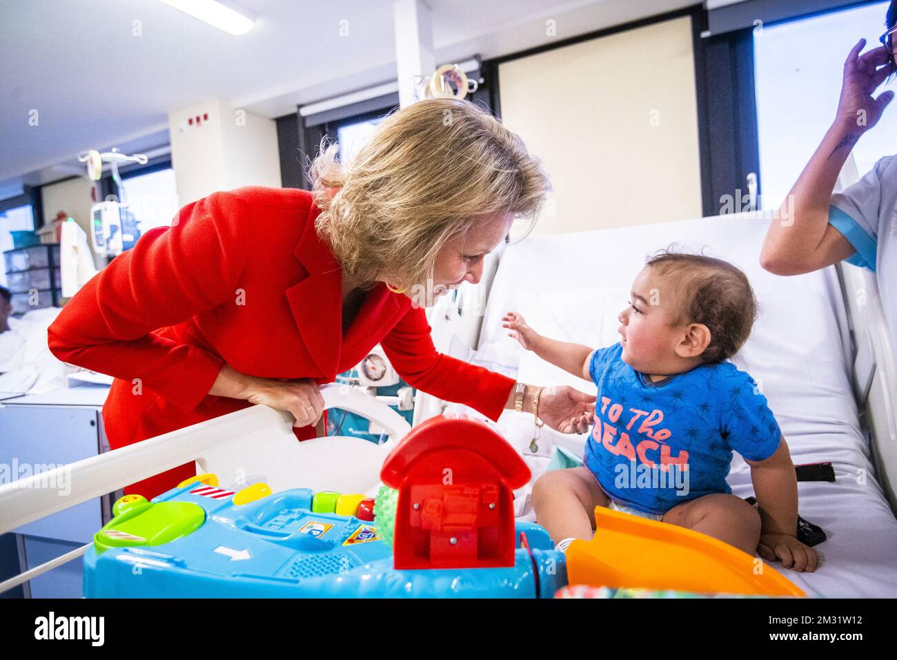 Queen Mathilde of Belgium meets a young patient during a royal visit to ...