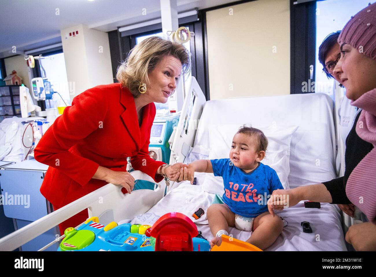 Queen Mathilde of Belgium meets a young patient during a royal visit to ...