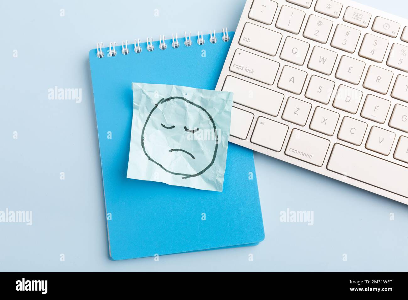 sad face on blue sticker,. High quality photo Stock Photo - Alamy