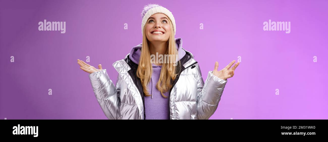 Thankful happy cute attractive blond young 25s woman in winter hat ...