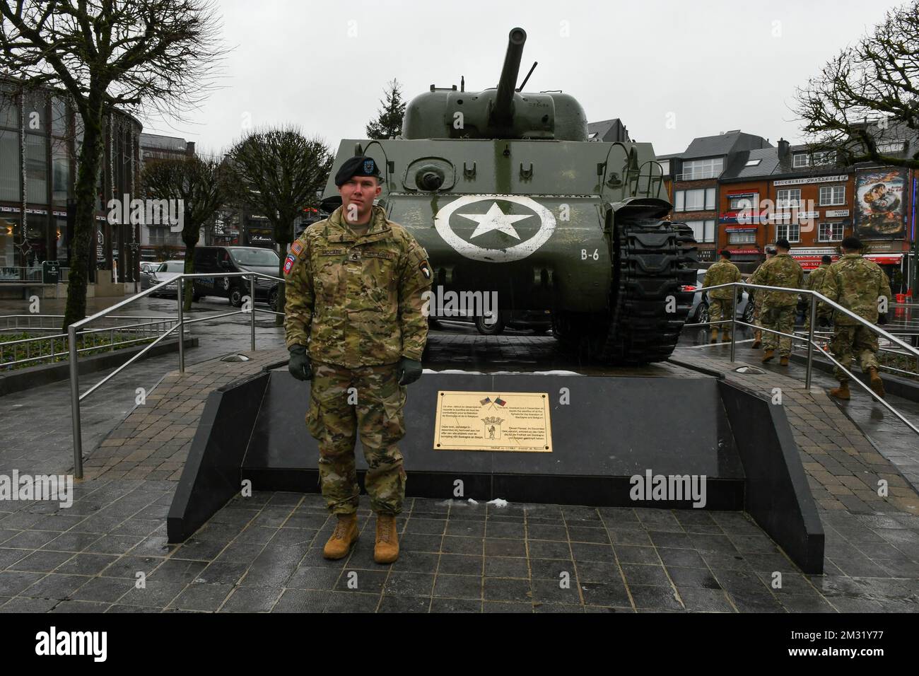 American soldiers pose in front of American tank at the Place General ...