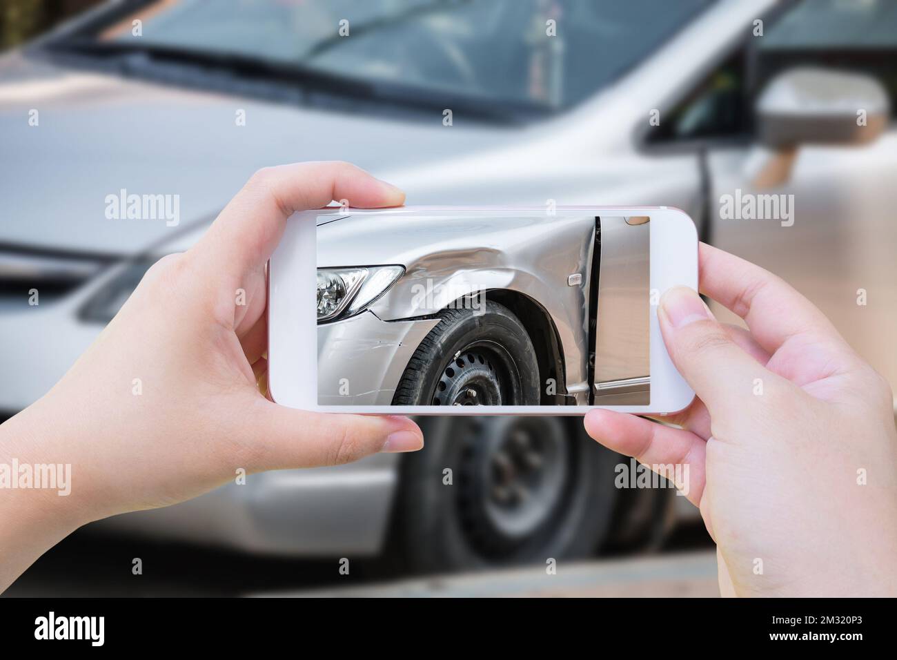 woman using mobile smartphone take photo car crash accident of the ...