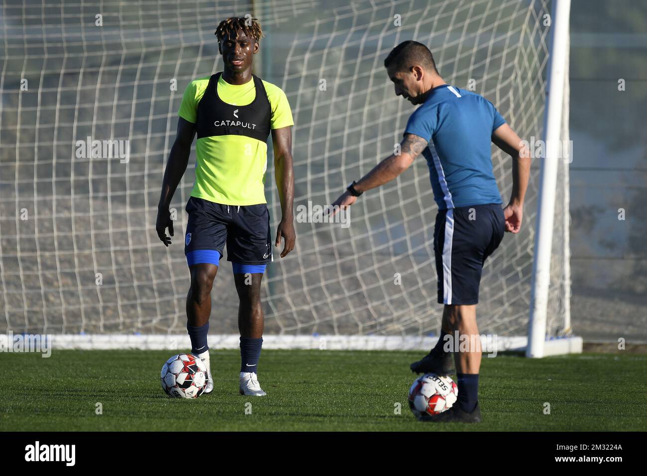 Genk's Stephen Pius Odey and Genk's youth players coach Michel Ribeiro ...