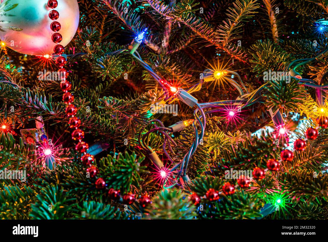 Festive moments christmas lights on tree hi-res stock photography and ...