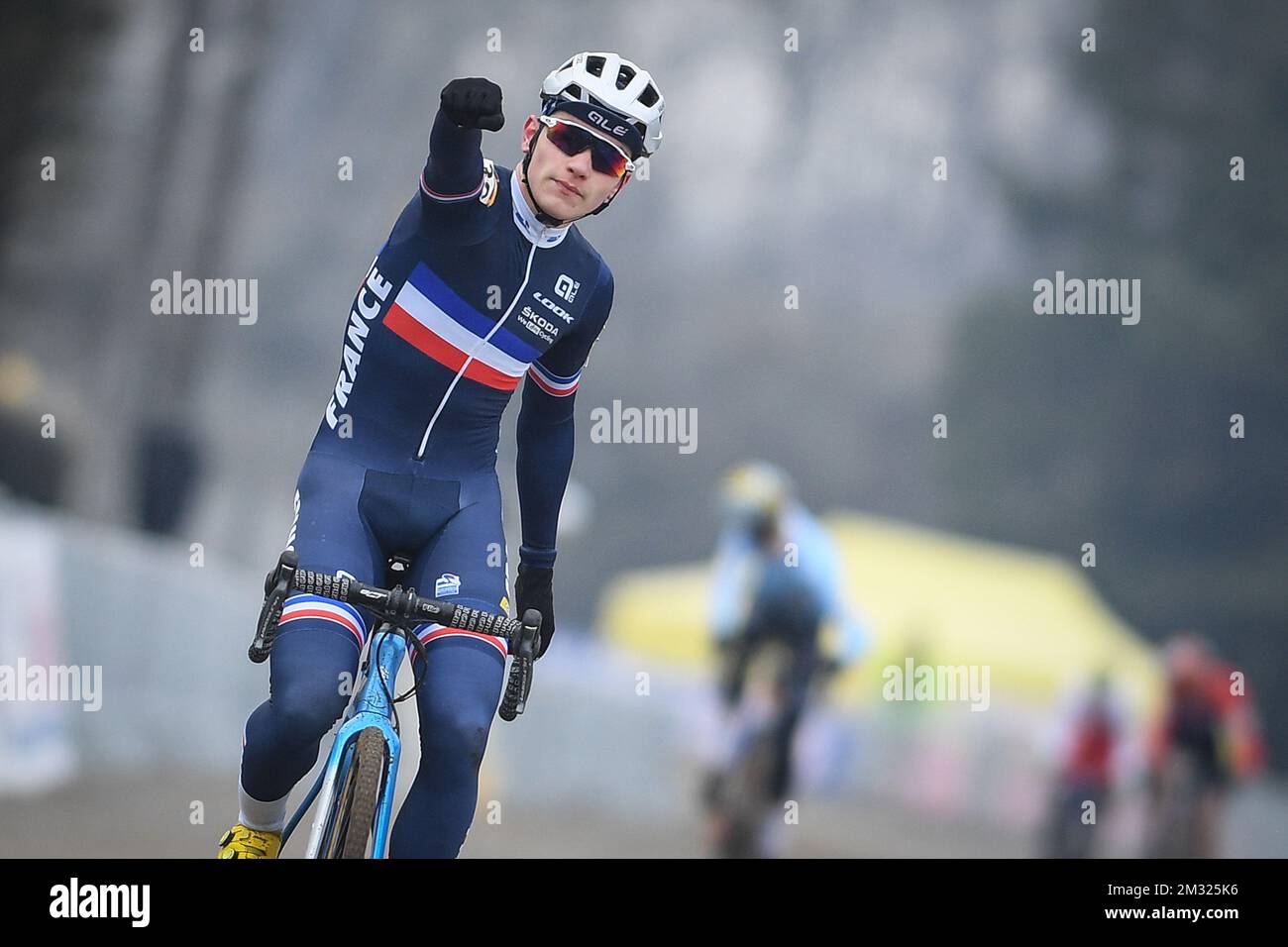 French Remi Lelandais crosses the finish line at the juniors race of ...