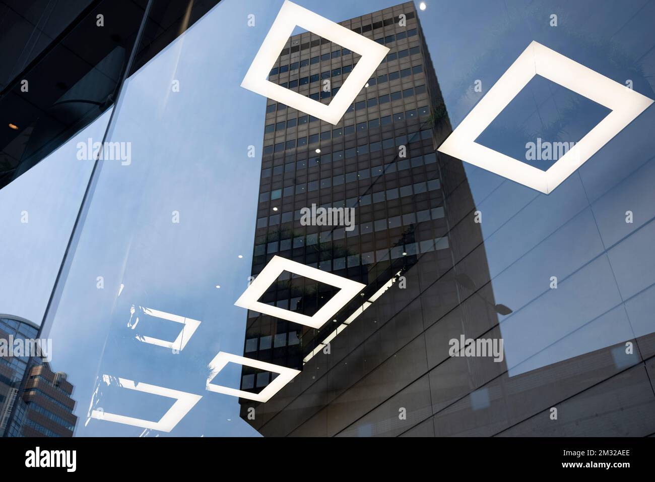 Repeating squares are seen in a corporate atrium space with an office ...