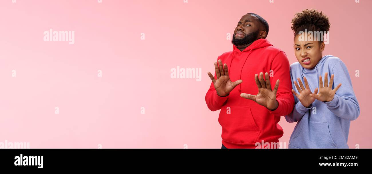 Studio shot pair african american friends woman man cringing disgust ...