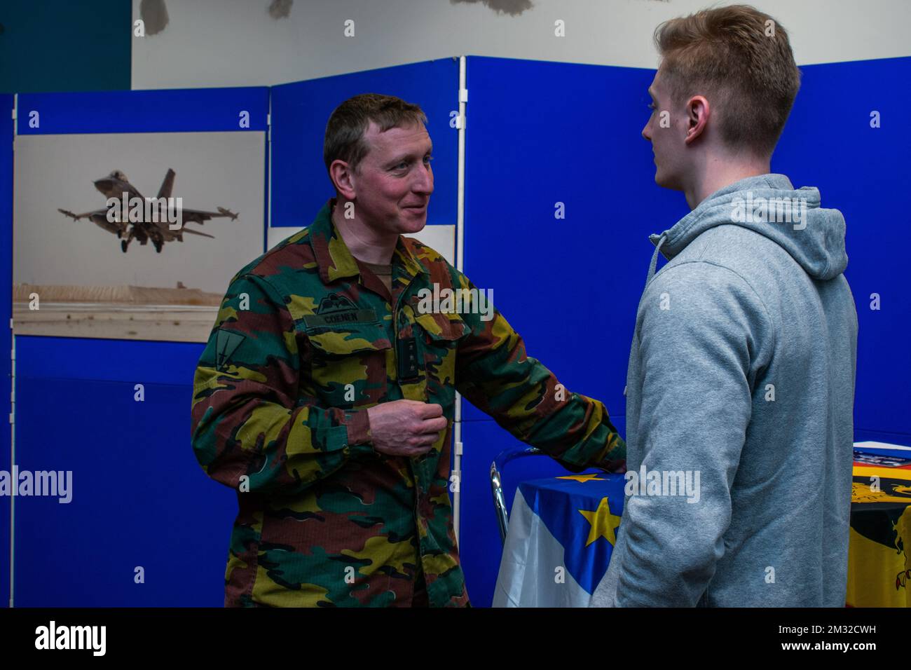 Johan Coenen (L) informing a young man at the Pop-Up store as the ...