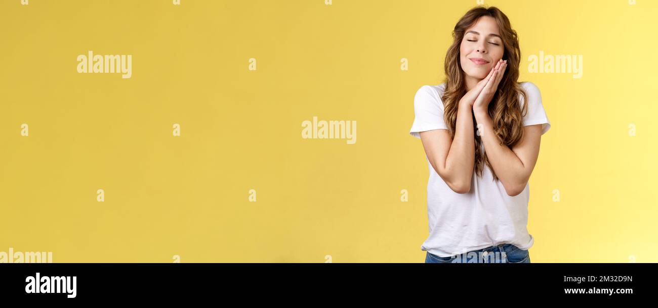 Happy relieved carefree charming european woman curly long hair close ...