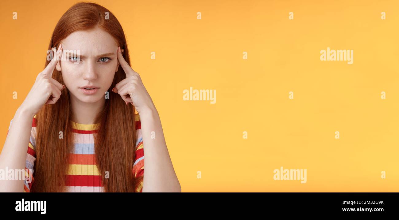 Puzzled serious-looking stressed-out young tired female student ...