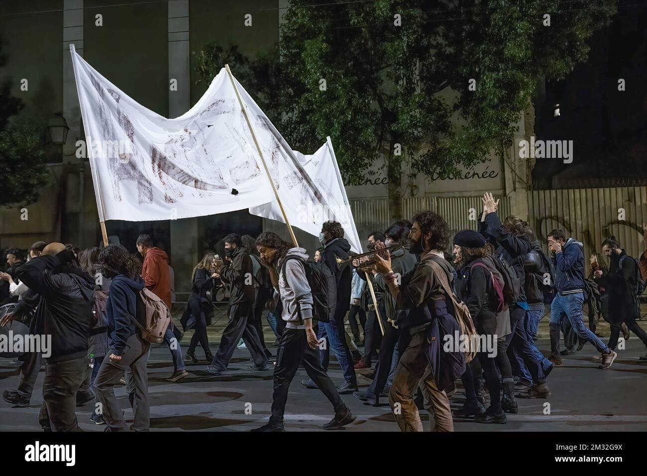 Athens, Greece. 13th Dec, 2022. Protesters hold a banner during the ...