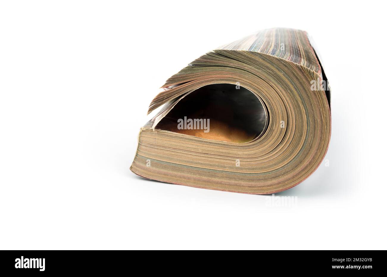 Rolled up magazines on a white background Stock Photo - Alamy