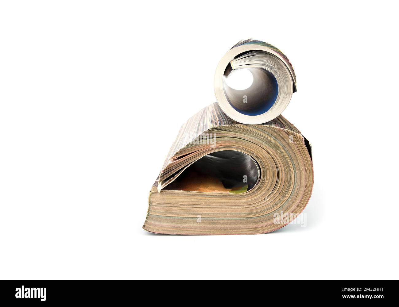 Rolled up magazines on a white background Stock Photo - Alamy