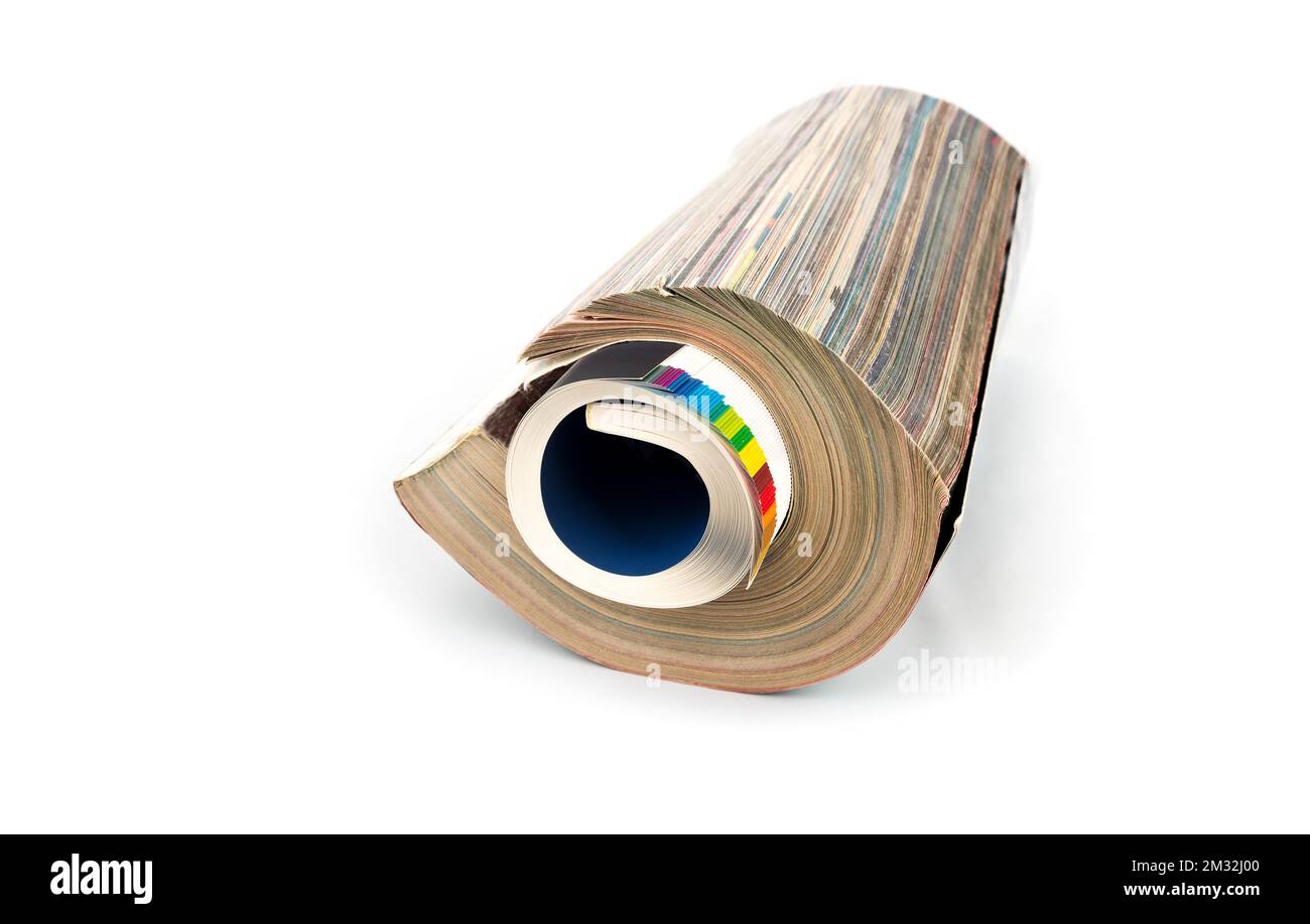 Rolled up magazines on a white background Stock Photo - Alamy
