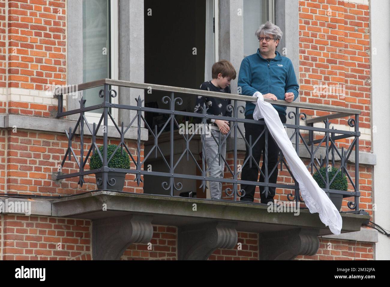 Illustration picture shows people hanging white sheets out of their ...