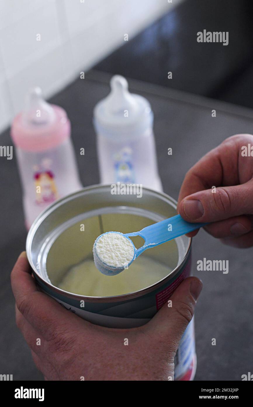Illustration picture shows someone measuring a dose of baby milk powder ...