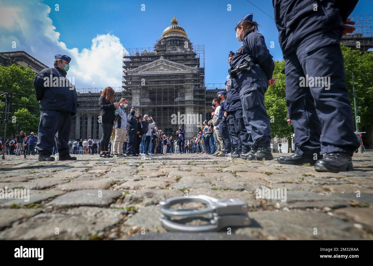 Illustration picture shows policemen laying down their handcuffs, a ...