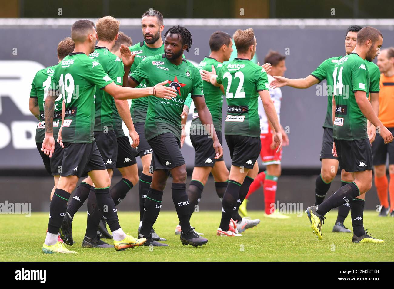 Cercle's players celebrate after scoring during a friendly game between ...