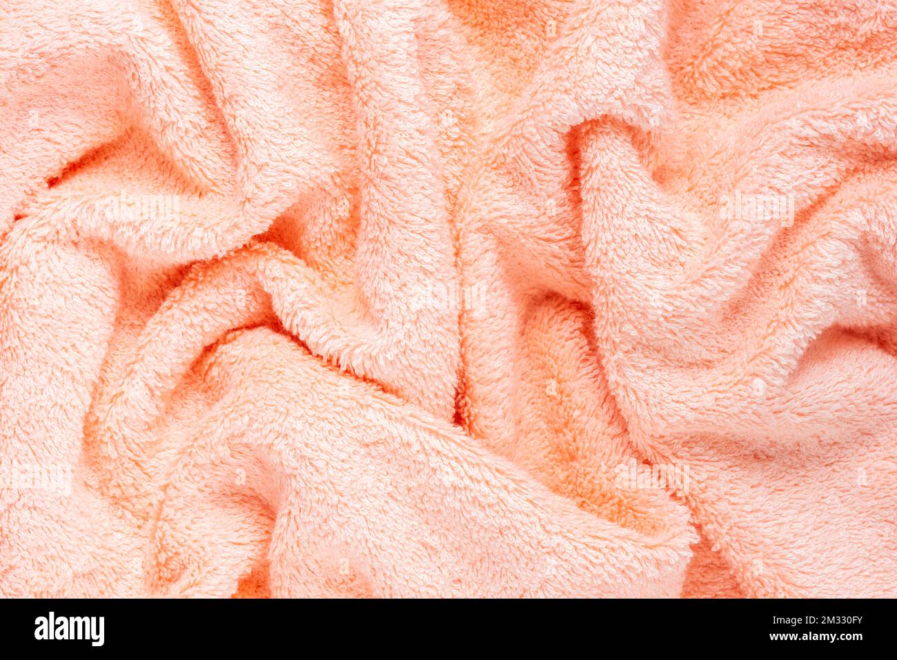 soft peach texture of bath towel folded, background Stock Photo - Alamy