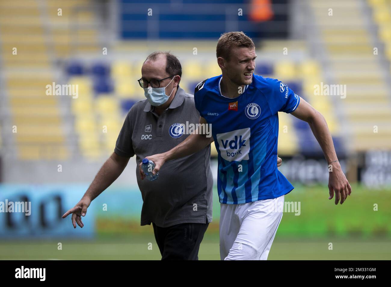 Gent's Igor Plastun leaves the pitch after being injured during the ...
