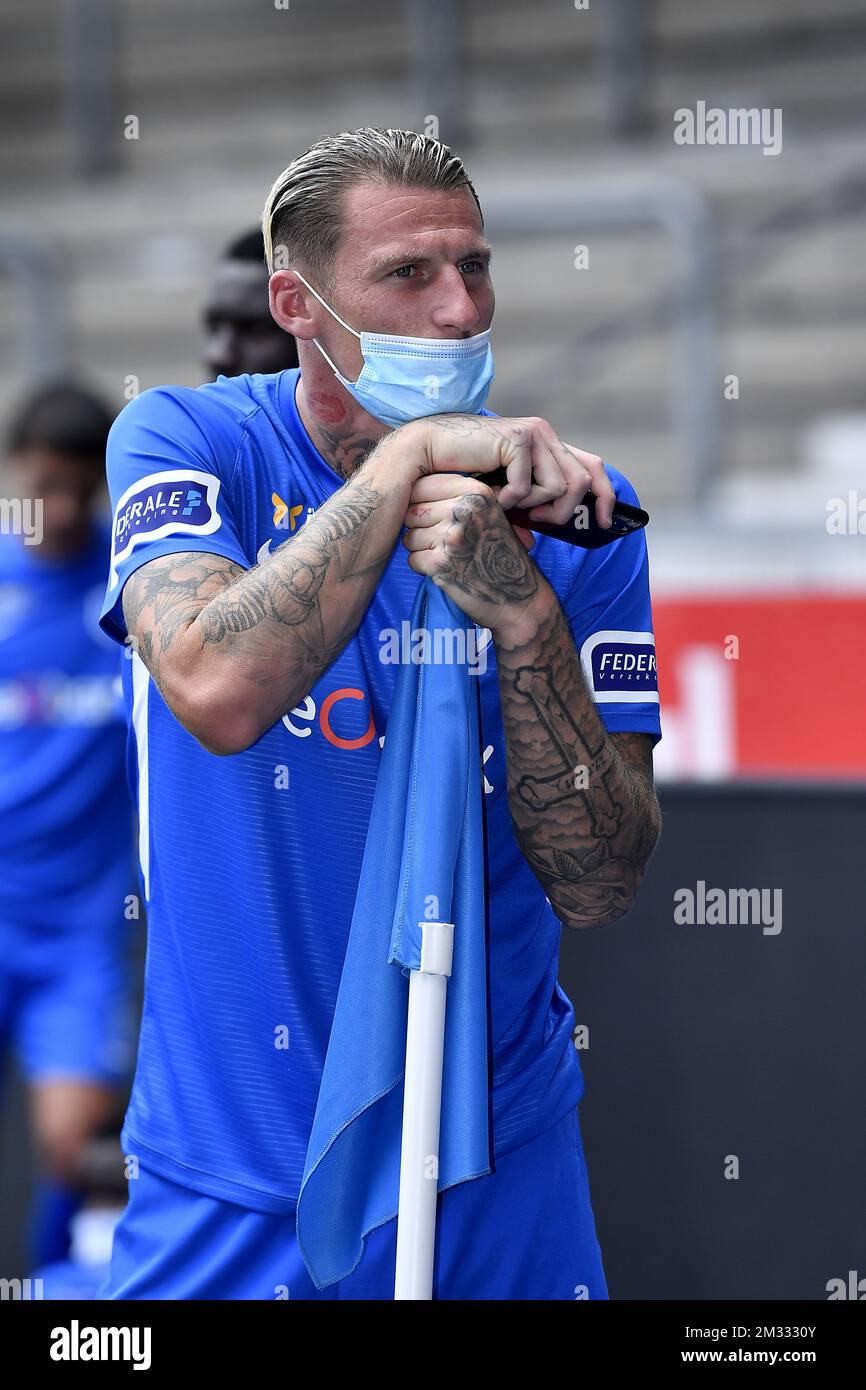 Genk's Sebastien Dewaest, wearing a mouth mask, arrives for poses for ...