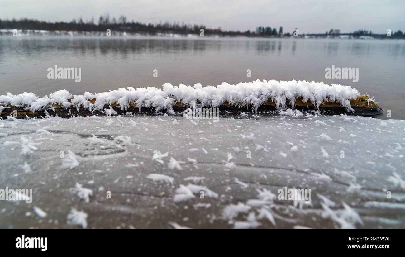 Frozen snow-white crystals of water on a pond Stock Photo - Alamy
