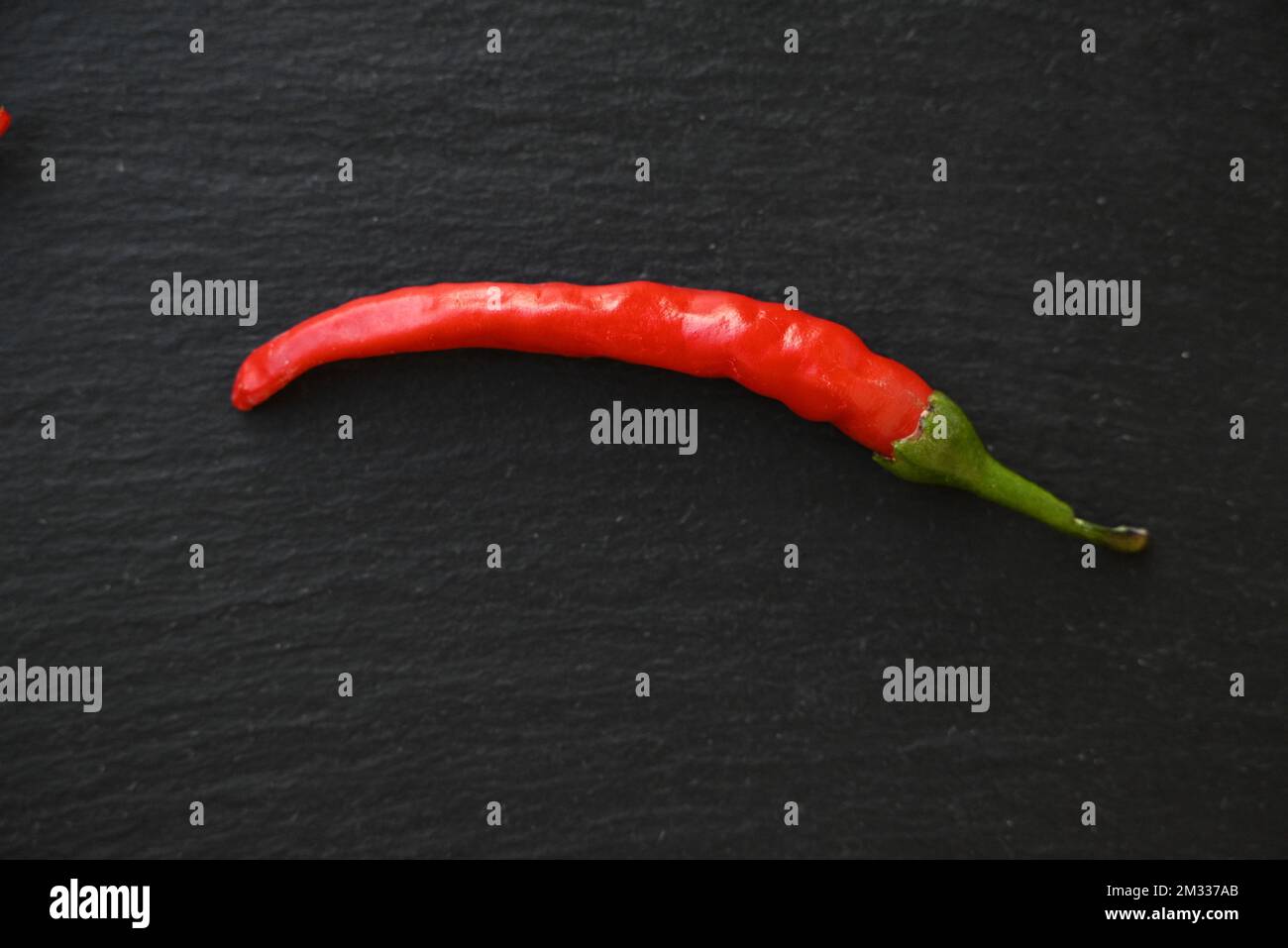 A top view of red pepper on the dark background Stock Photo - Alamy