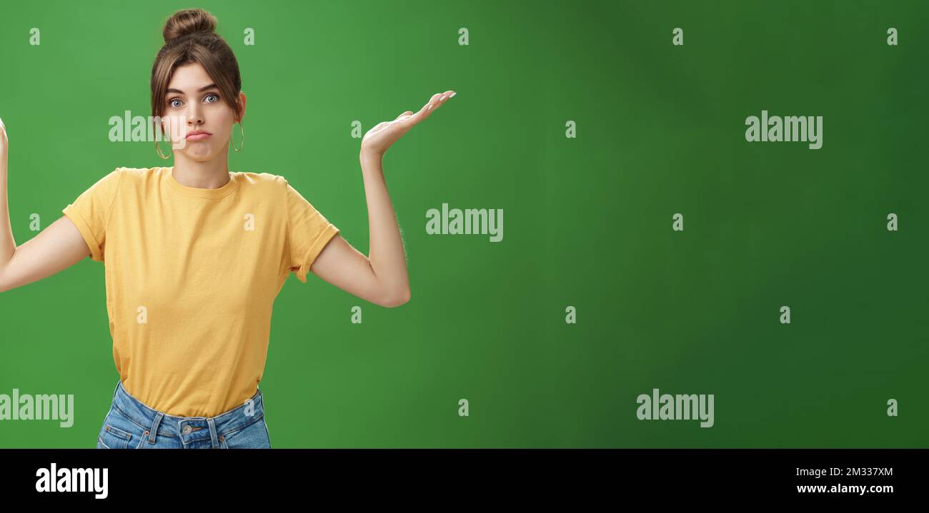 Girl do not know anything. Portrait of confused unsure cute woman with ...