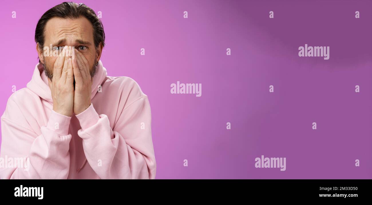 Shocked upset concerned adult husband grieving look heartbroken suffer ...