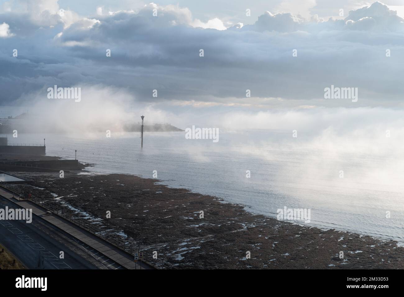 Sea mist rolling in on a freezing cold morning in Ramsgate, Kent, UK ...