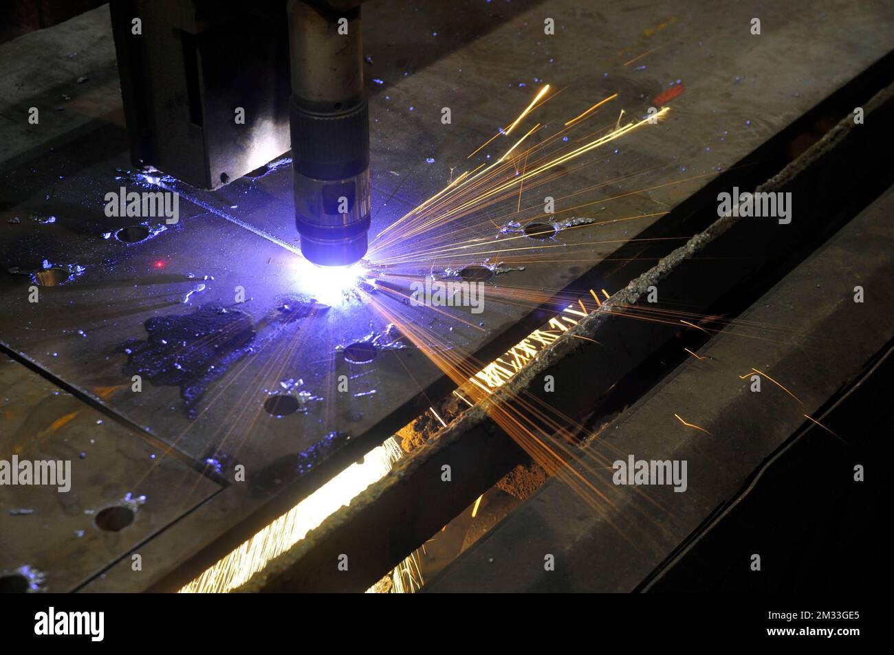 Metal cutting processing. The process of cutting sheet metal on a CNC machine using plasma ...