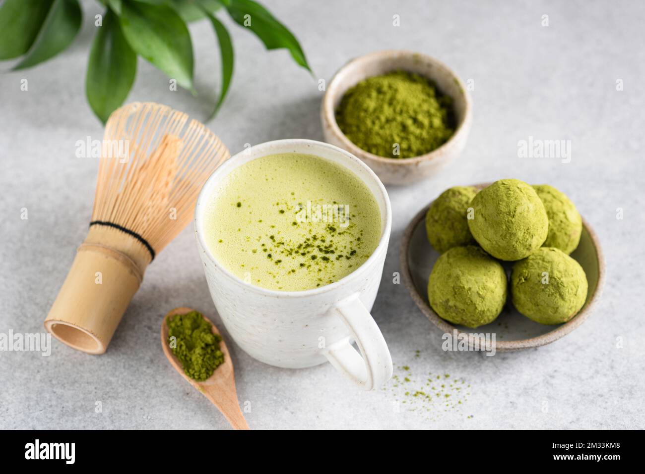 Green tea Matcha and matcha chocolate truffles on grey background ...