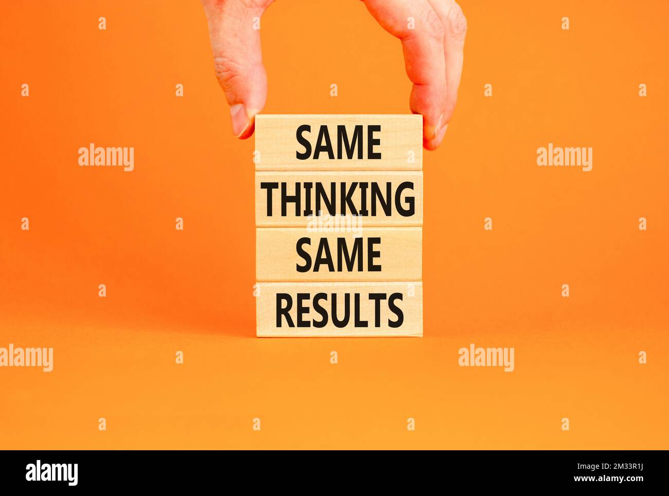 Same thinking and results symbol. Concept word Same thinking same results on wooden blocks ...