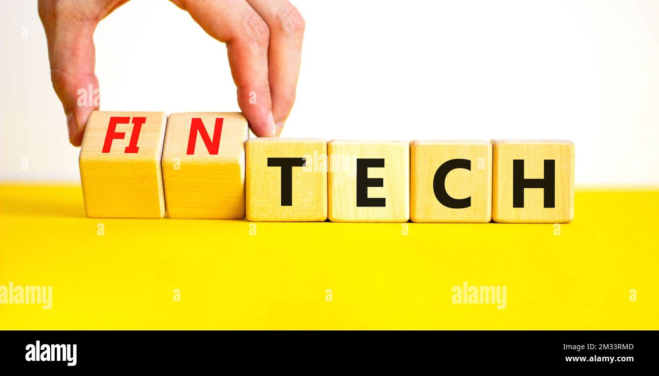 Tech or fintech symbol. Concept word Tech and Fintech on wooden cubes ...
