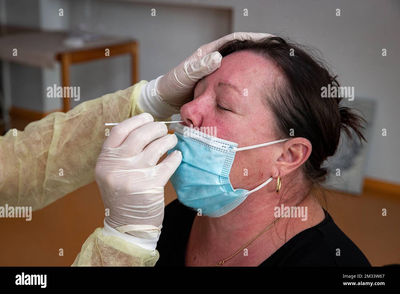 Illustration shows a visitor undergoing a Corona fast test upon arrival ...