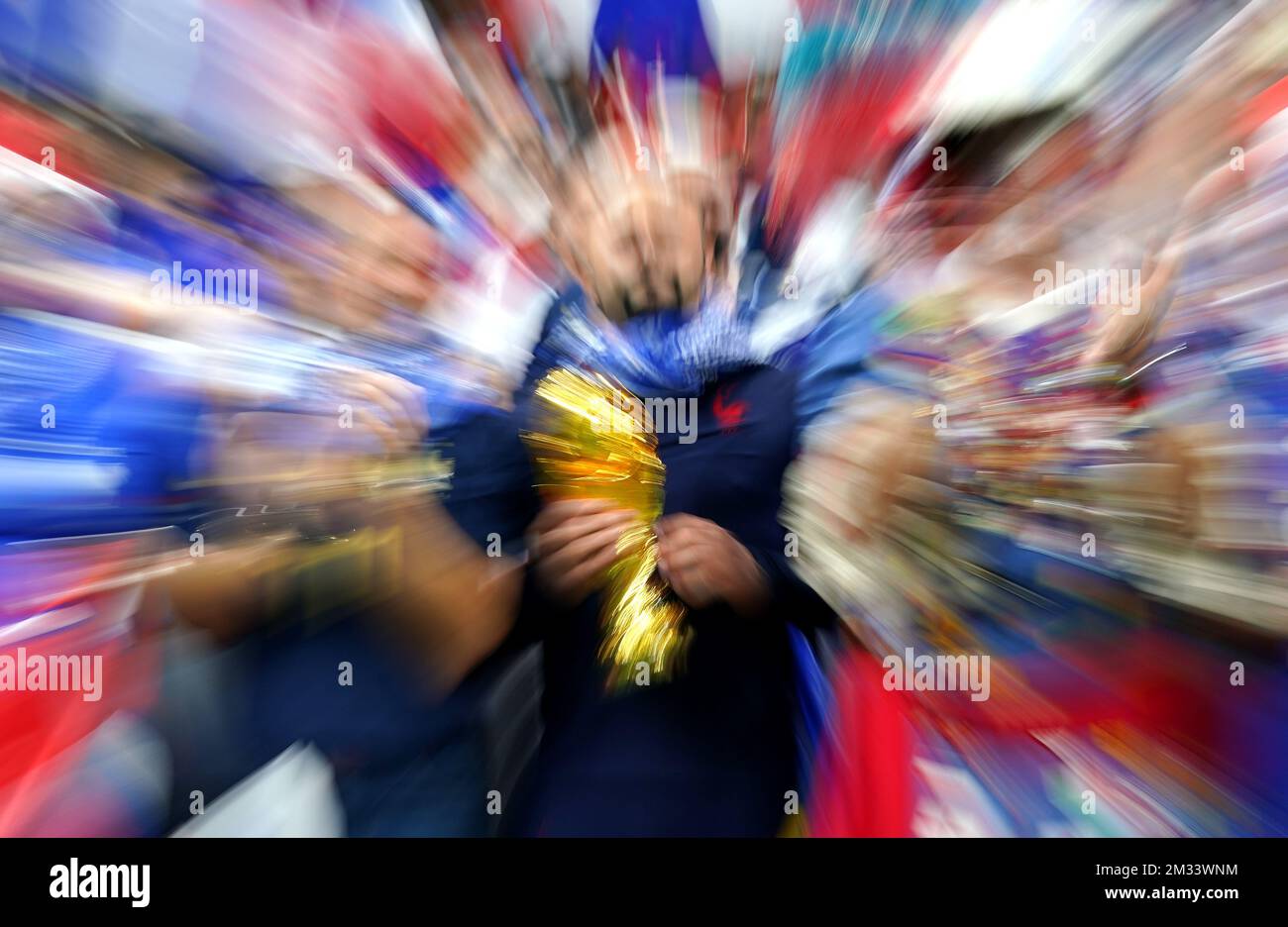 A France fan holds up a replica World Cup trophy before the FIFA World ...