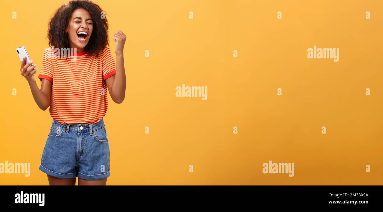Portrait of ambitious happy young african american girl yelling from ...