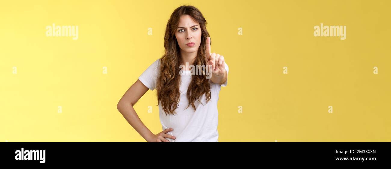 Not on my watch. Serious-looking confident empowered woman protect ...