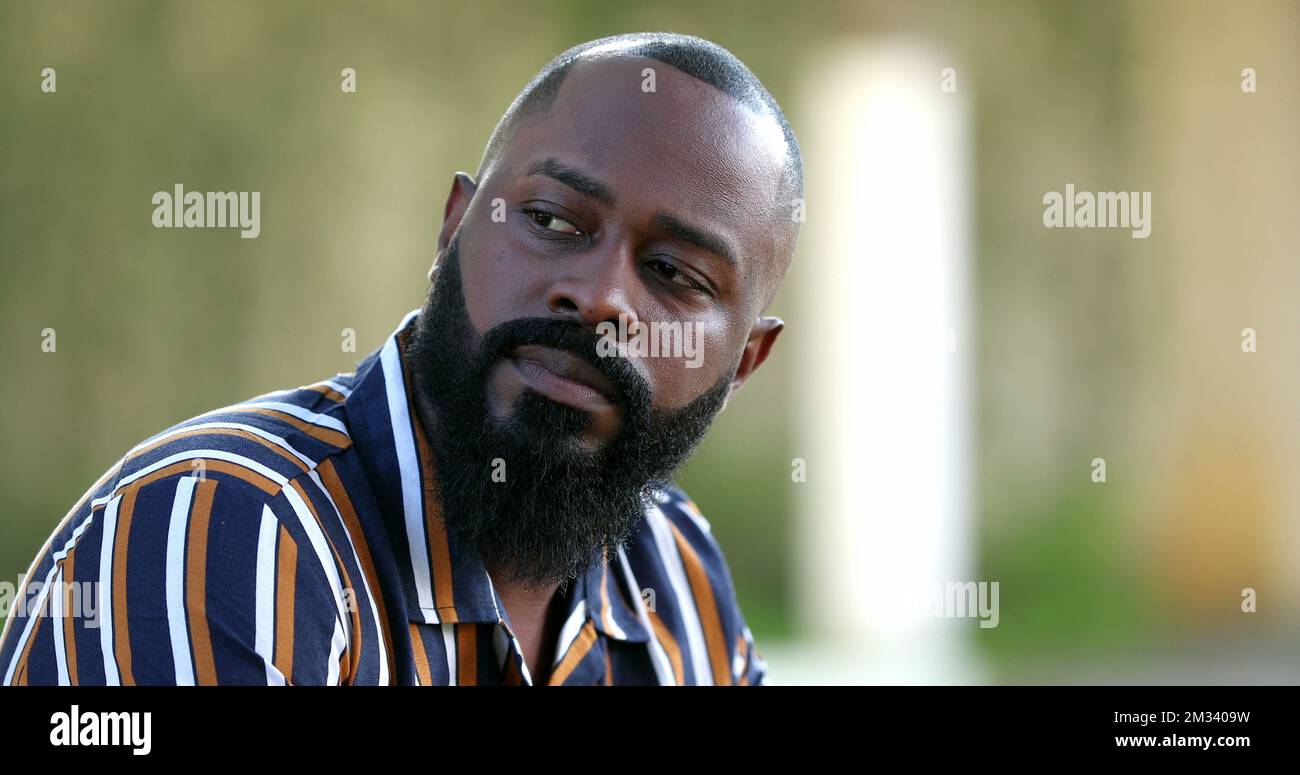 Thoughtful black African man thinking of solution-1 Stock Photo - Alamy