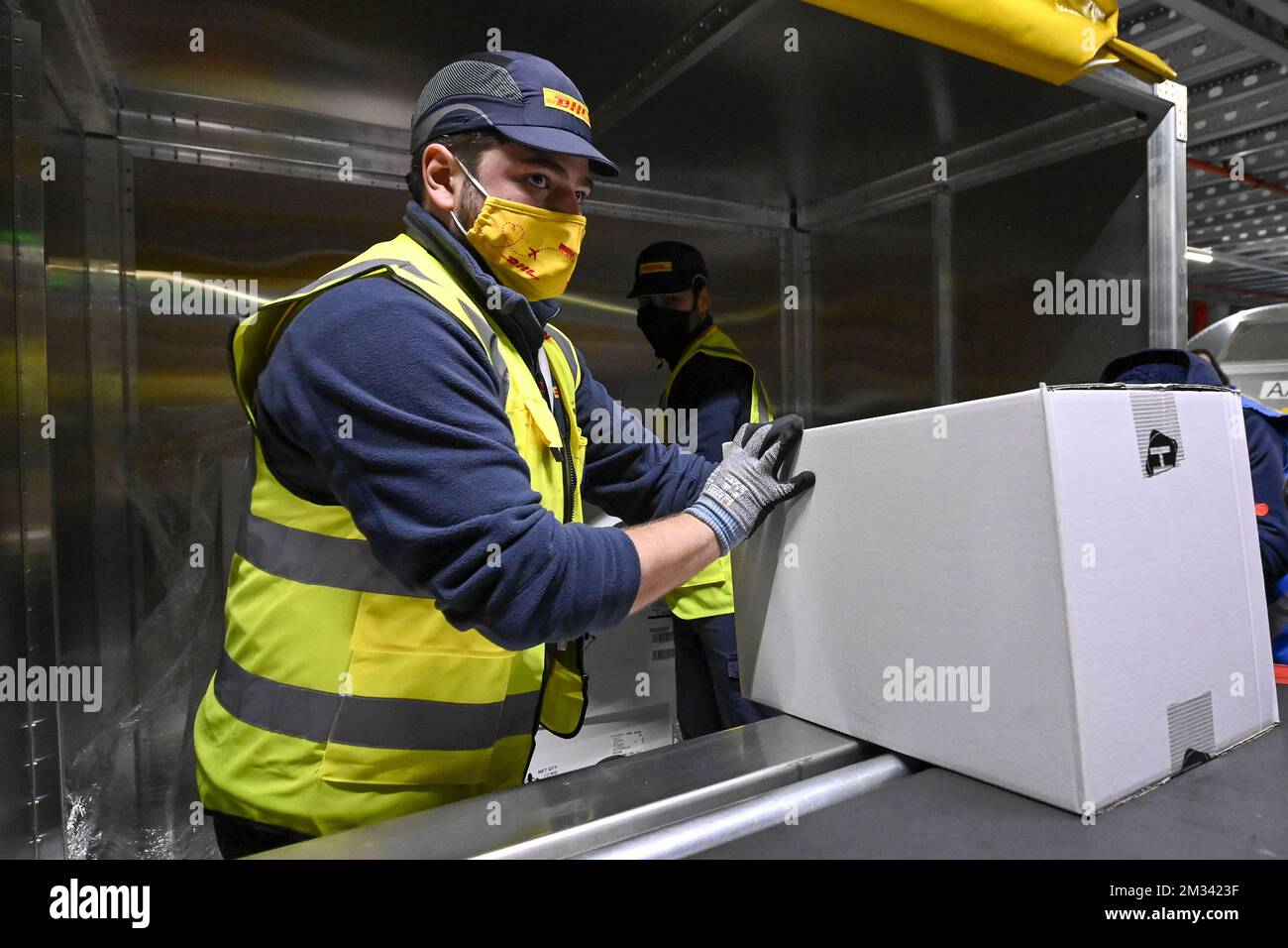 Illustration picture shows workers in action at the DHL hub at Brussels ...