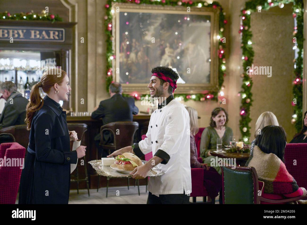 HOTEL FOR THE HOLIDAYS, from left: Madelaine Petsch, Mena Massoud, 2022 ...