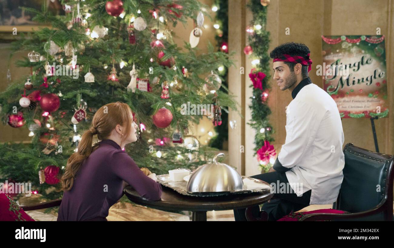 HOTEL FOR THE HOLIDAYS, from left: Madelaine Petsch, Mena Massoud, 2022 ...