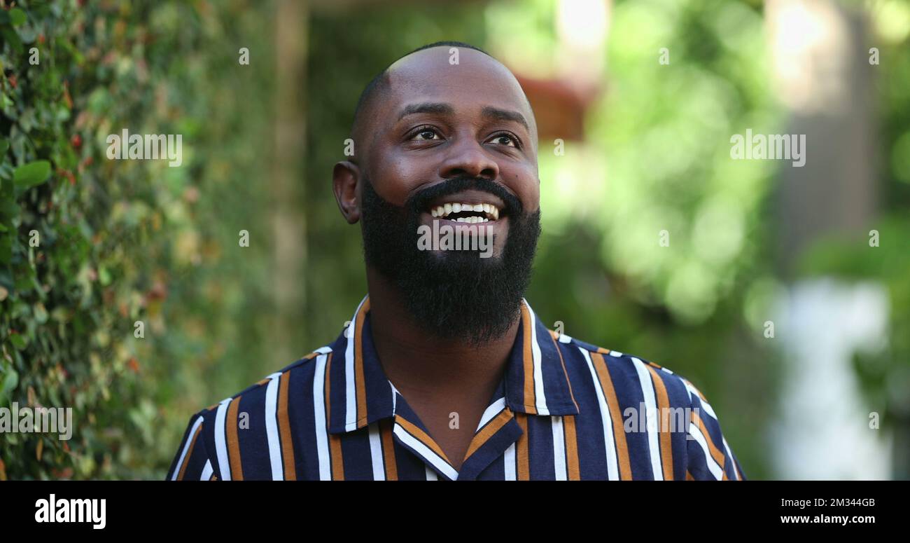 Positive happy African man smiling outside breathing fresh air-1 Stock ...