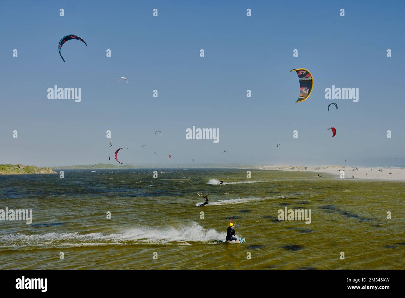 Kite surfers taking advantage of a very windy day on the Klein River ...