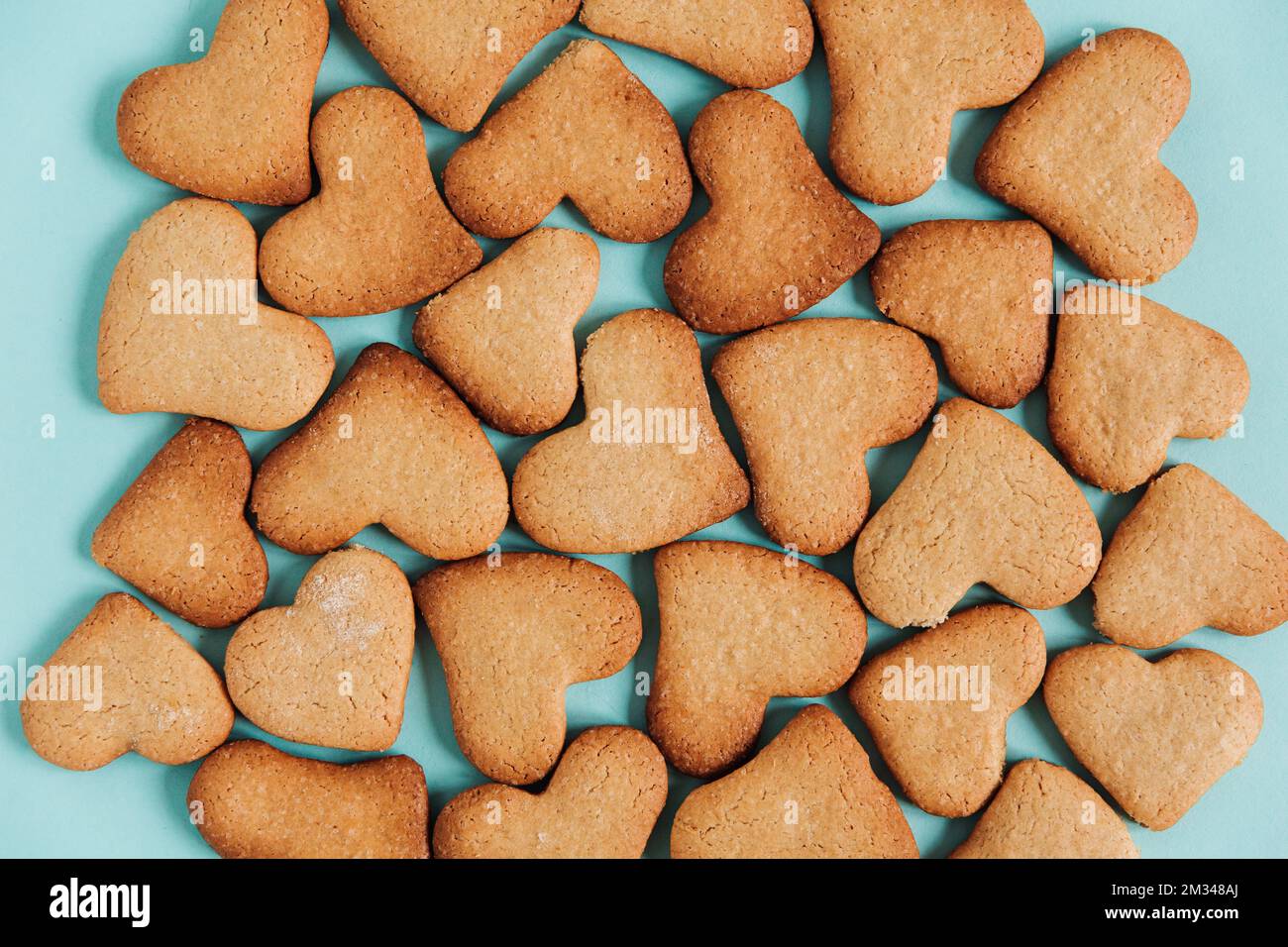 Homemade heart shaped cookies for Valentines day. Top view. Blue ...