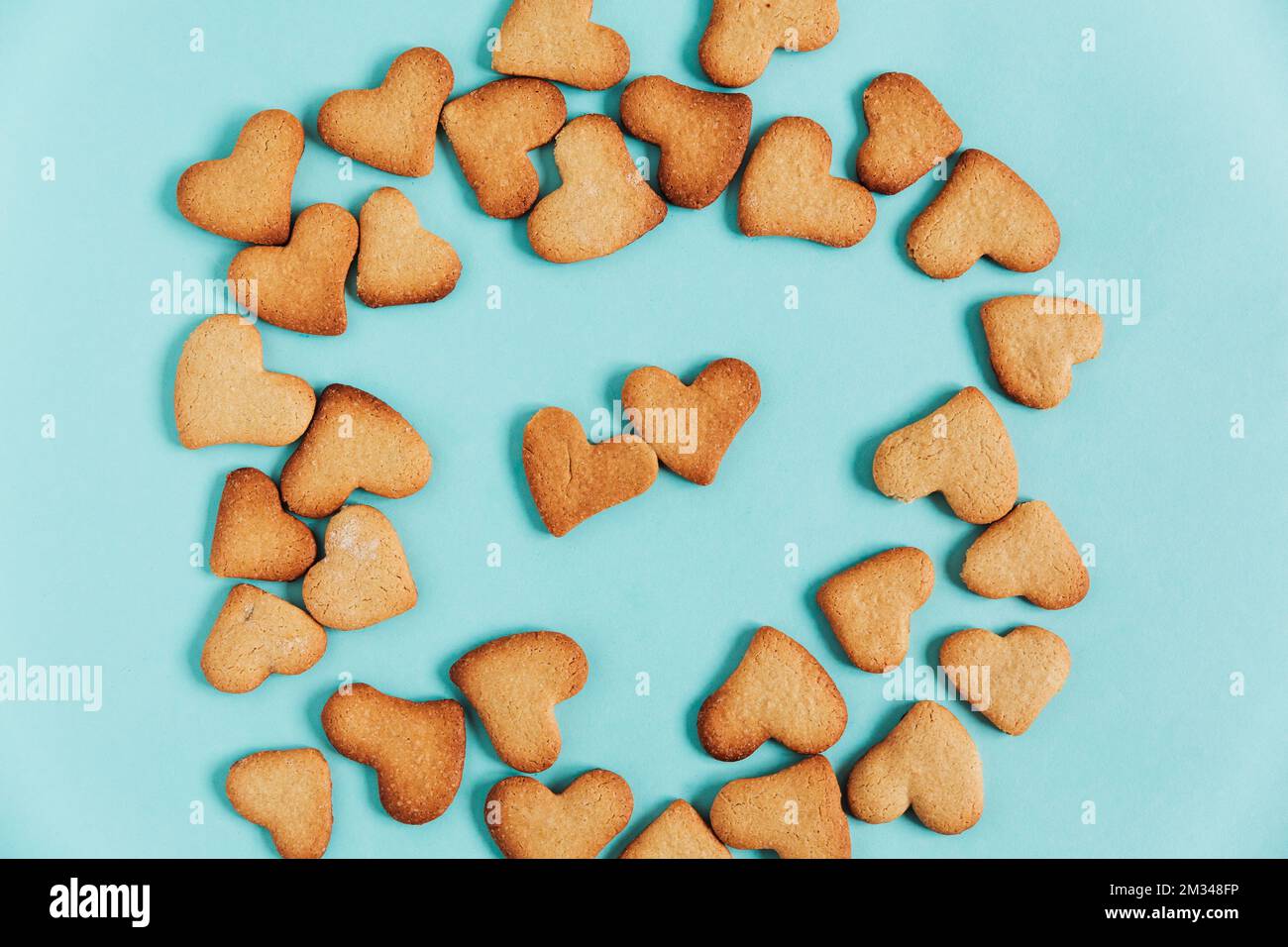 Homemade heart shaped cookies for Valentines day. Top view. Blue ...