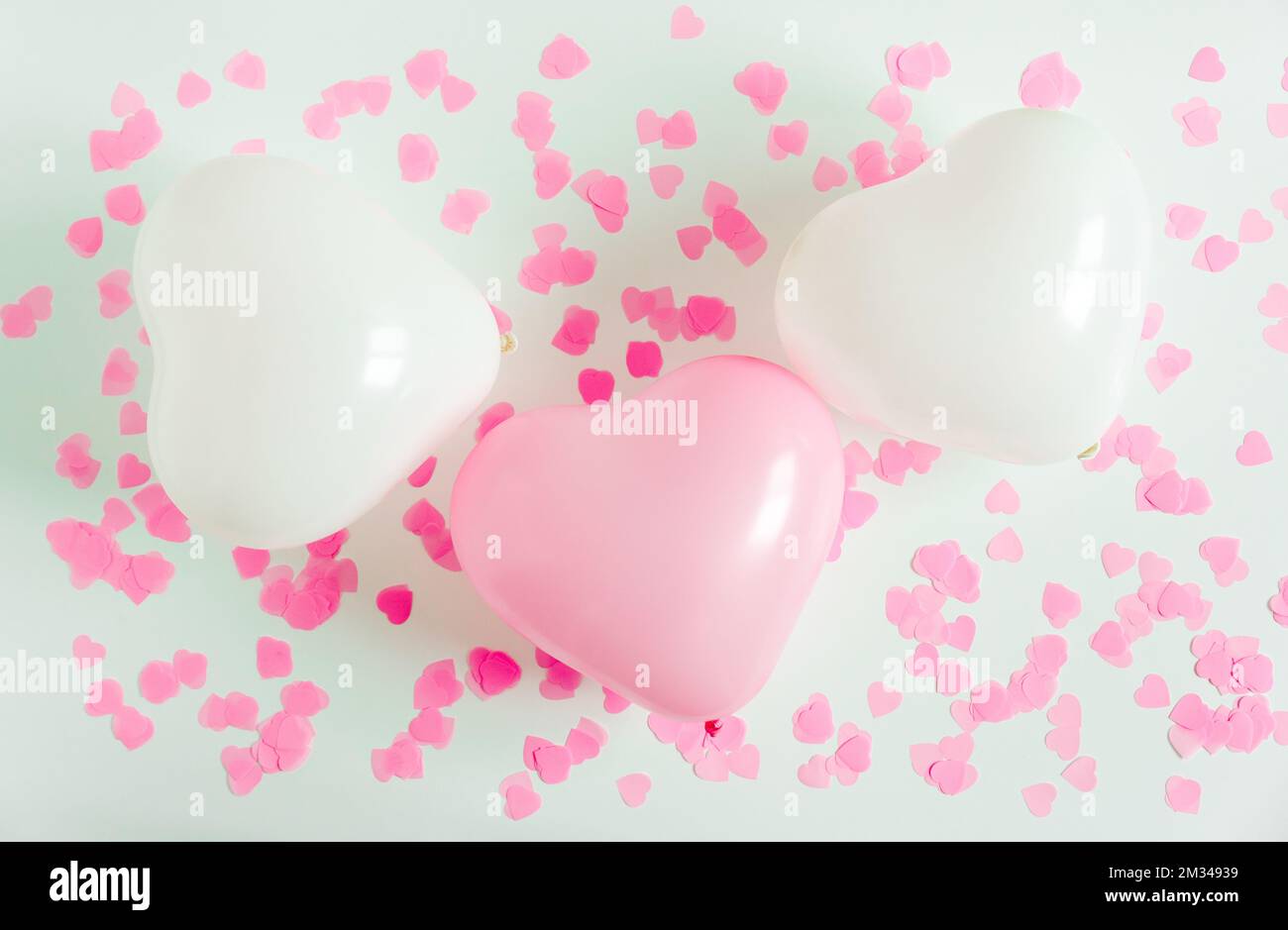 Valentines day composition. White background with white and pink heart ...