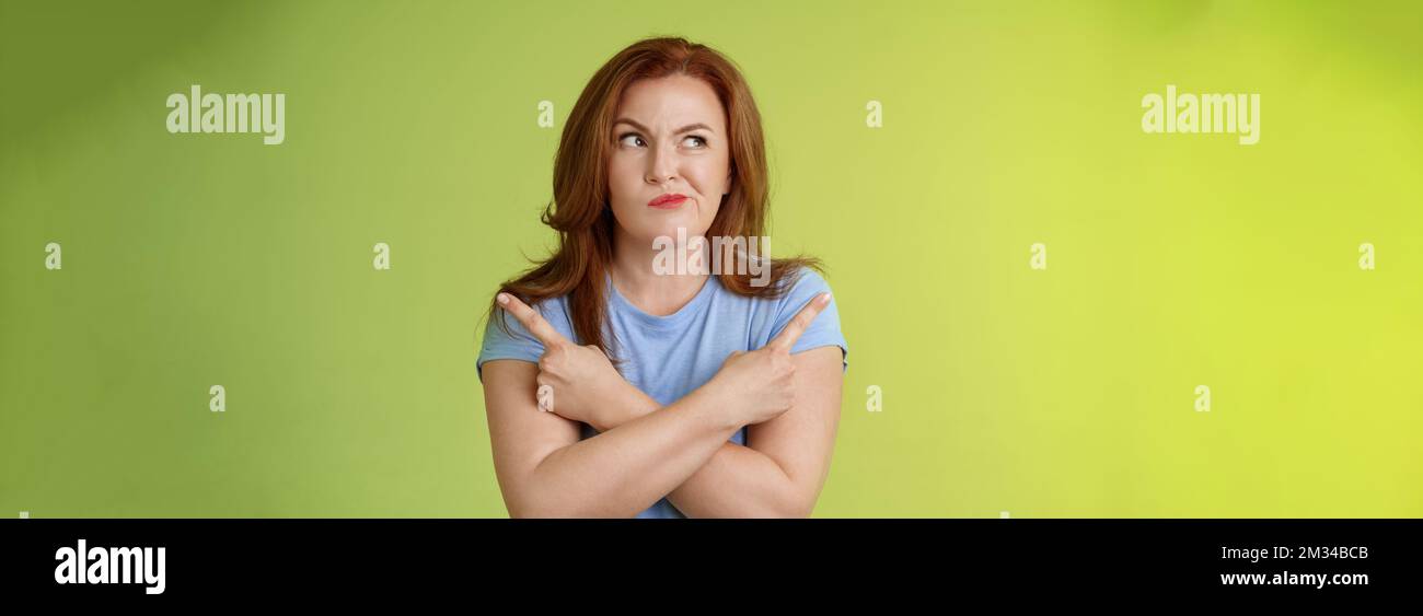 Time make right choice. Perplexed hesitant redhead middle-aged female ...