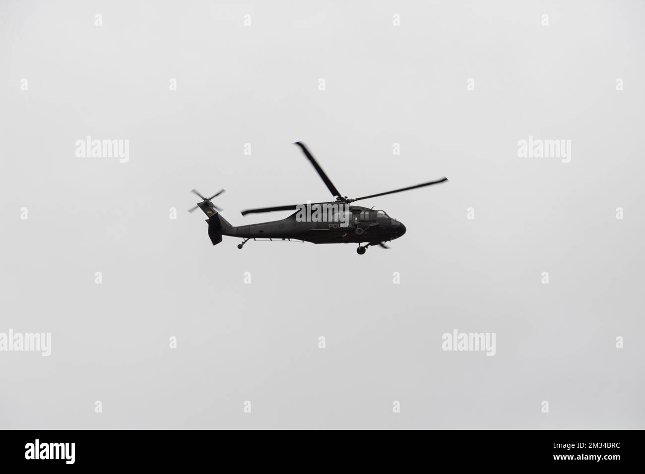 police black hawk helicopter flying over crow during colombian ...